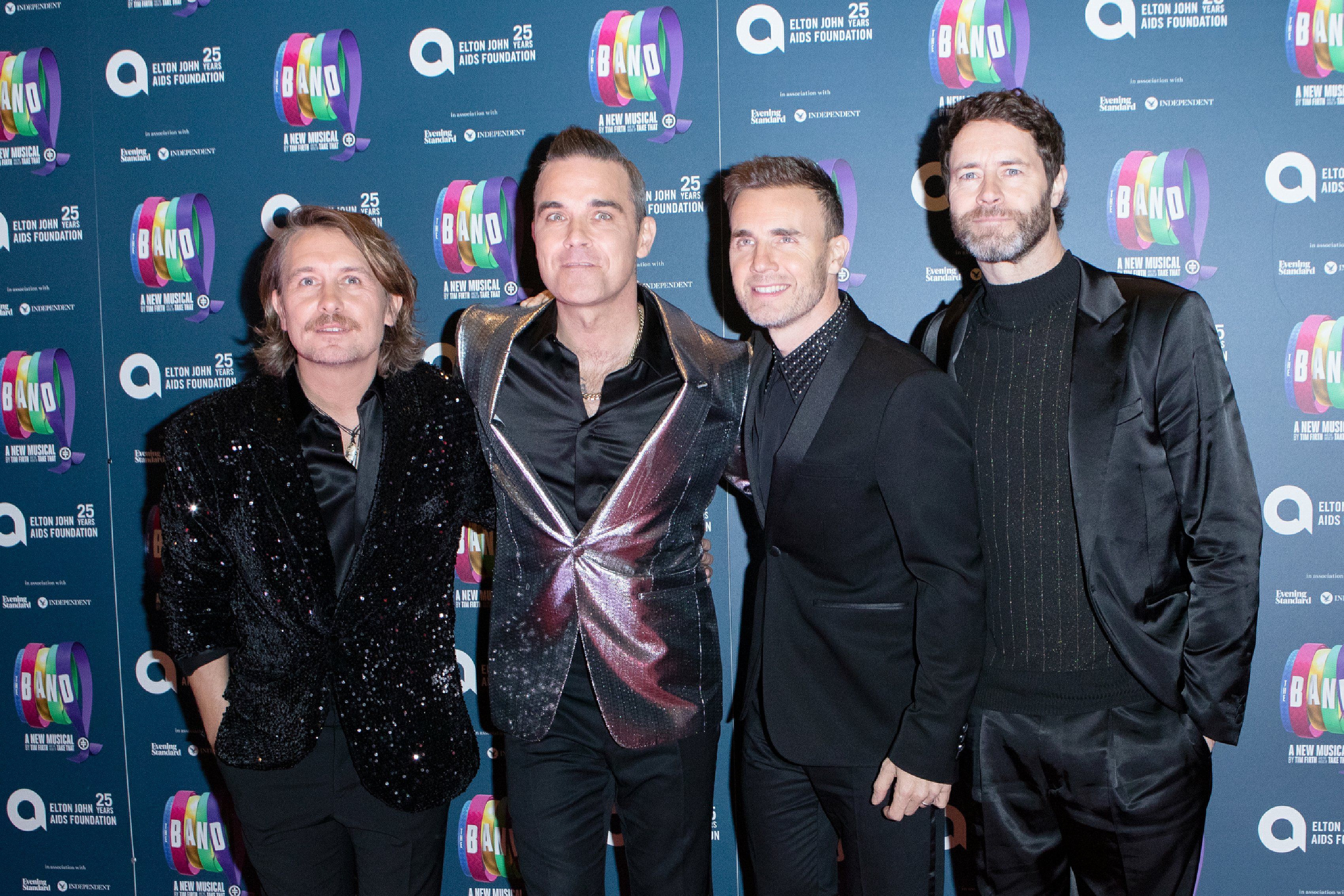 What Really Happened Between Robbie Williams And His Former Band Take That?